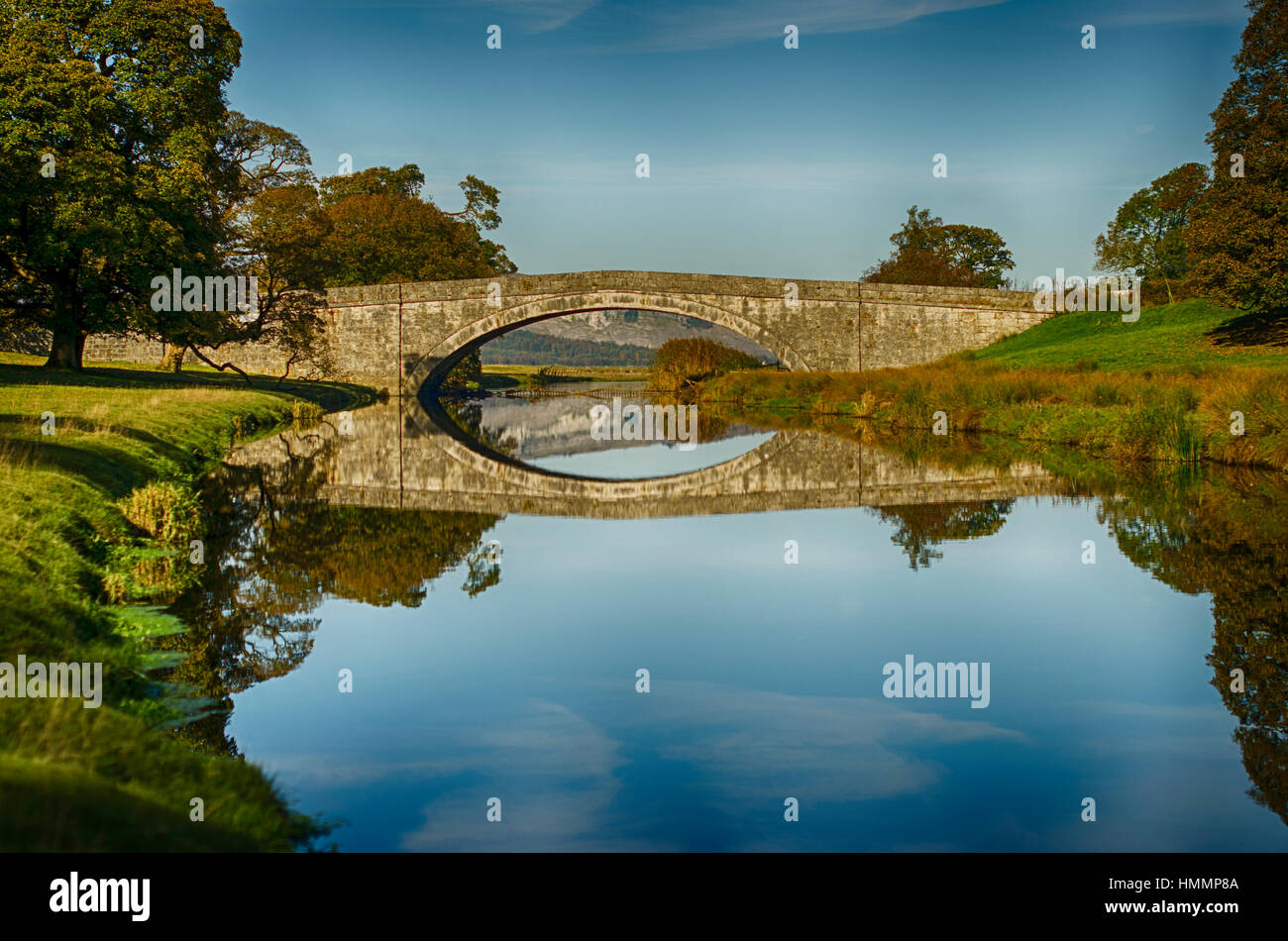 Bridge in Dallam Park, Milnthorpe, Cumbria passing over the river Bela ...
