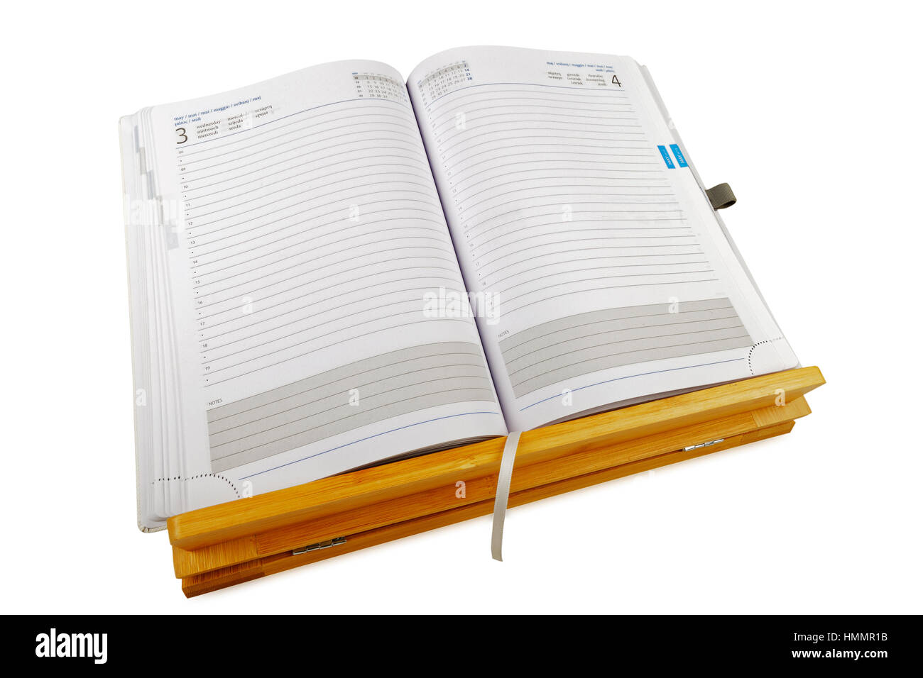open notebook on wooden rack, isolated, studio shot Stock Photo - Alamy