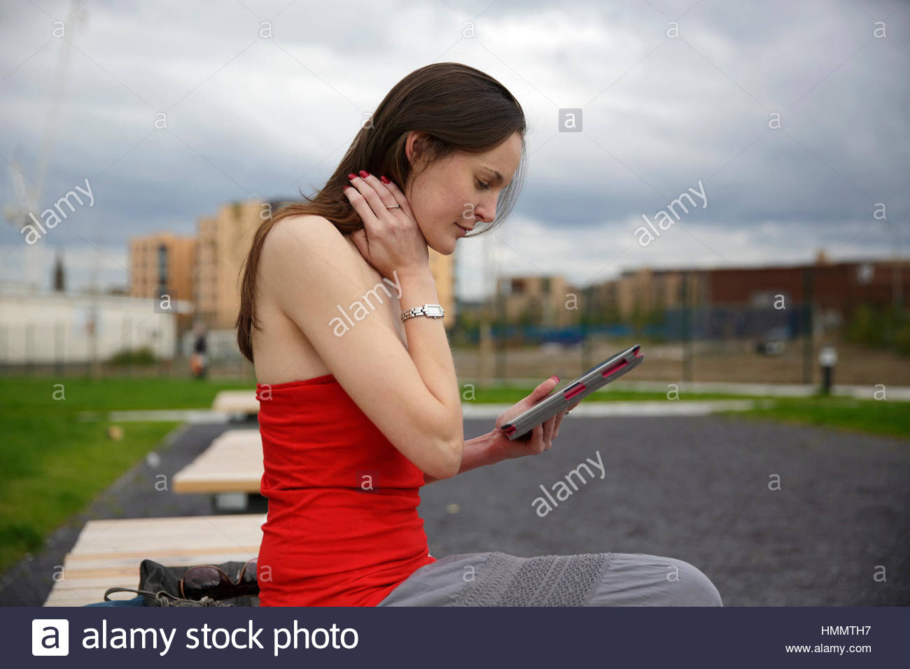 Woman using a Tablet device in an urban environment Stock Photo - Alamy