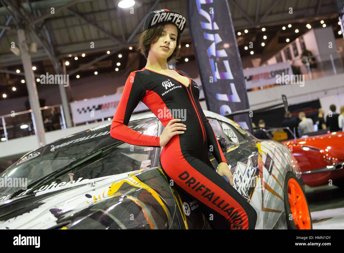 Moscow, Russia. 4th Feb, 2017. A model poses in front of a racing car ...