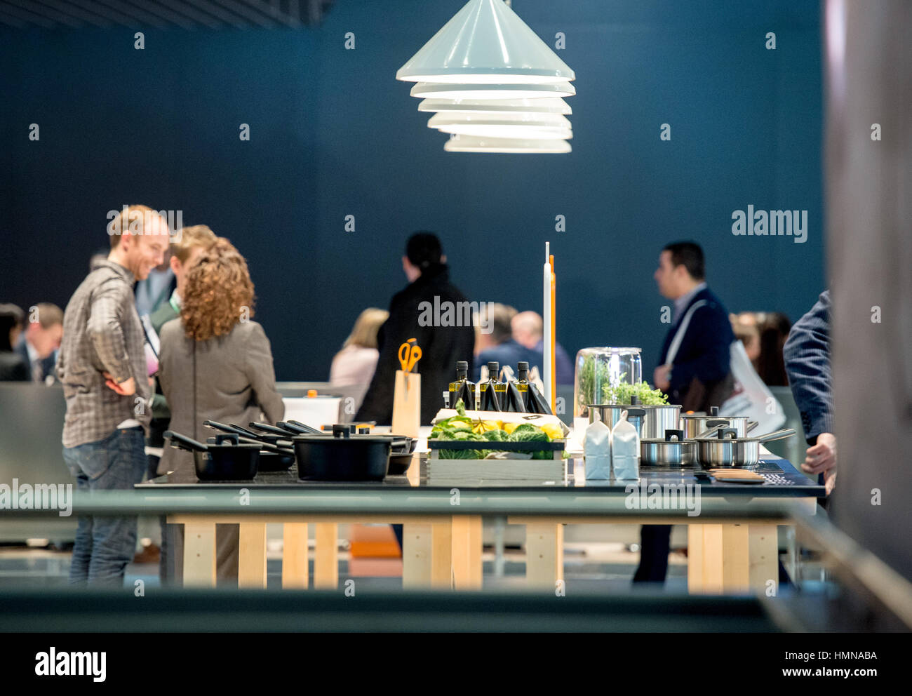 Visitors look at displayed items at the Ambiente Consumer Goods Show in ...