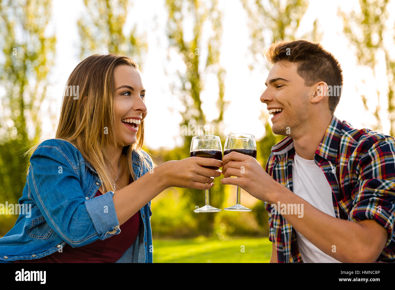 Seated on picnic blanket hi-res stock photography and images - Alamy