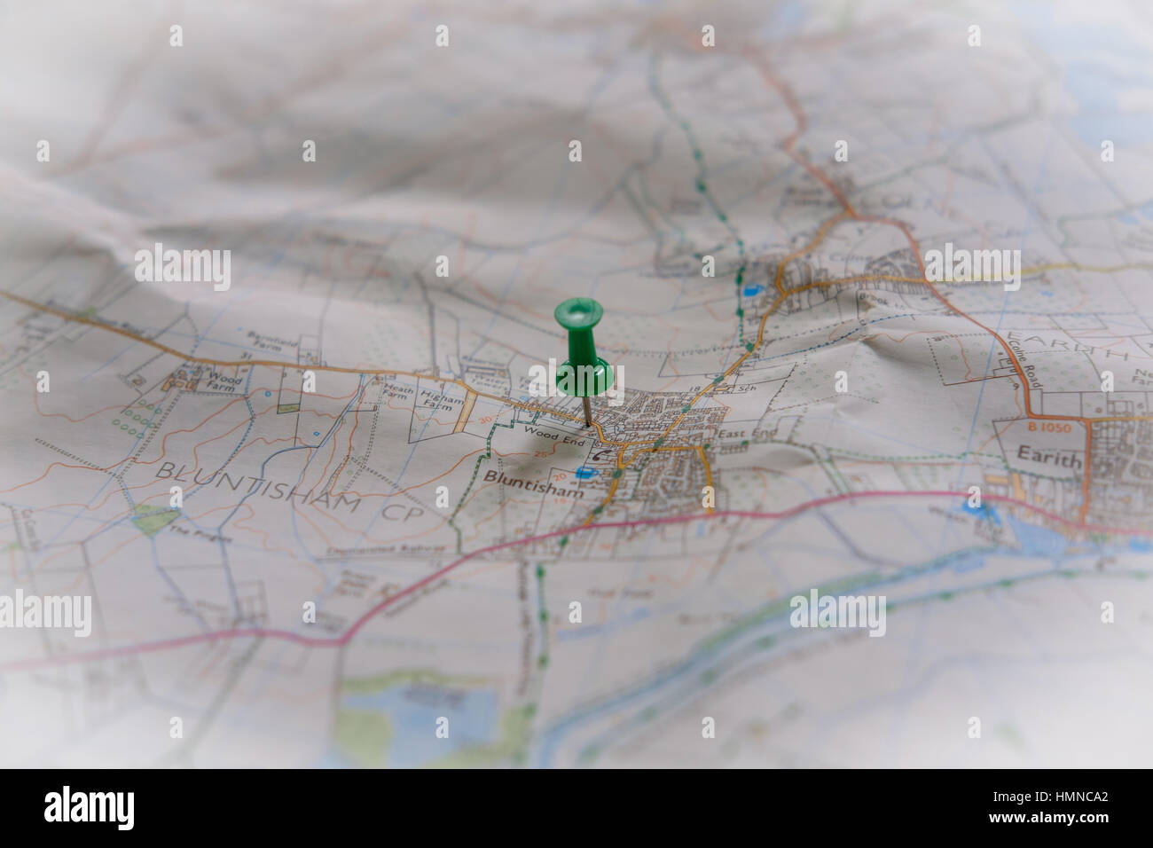 Close-up image of coloured pins seen on a hiking and trail paper map ...