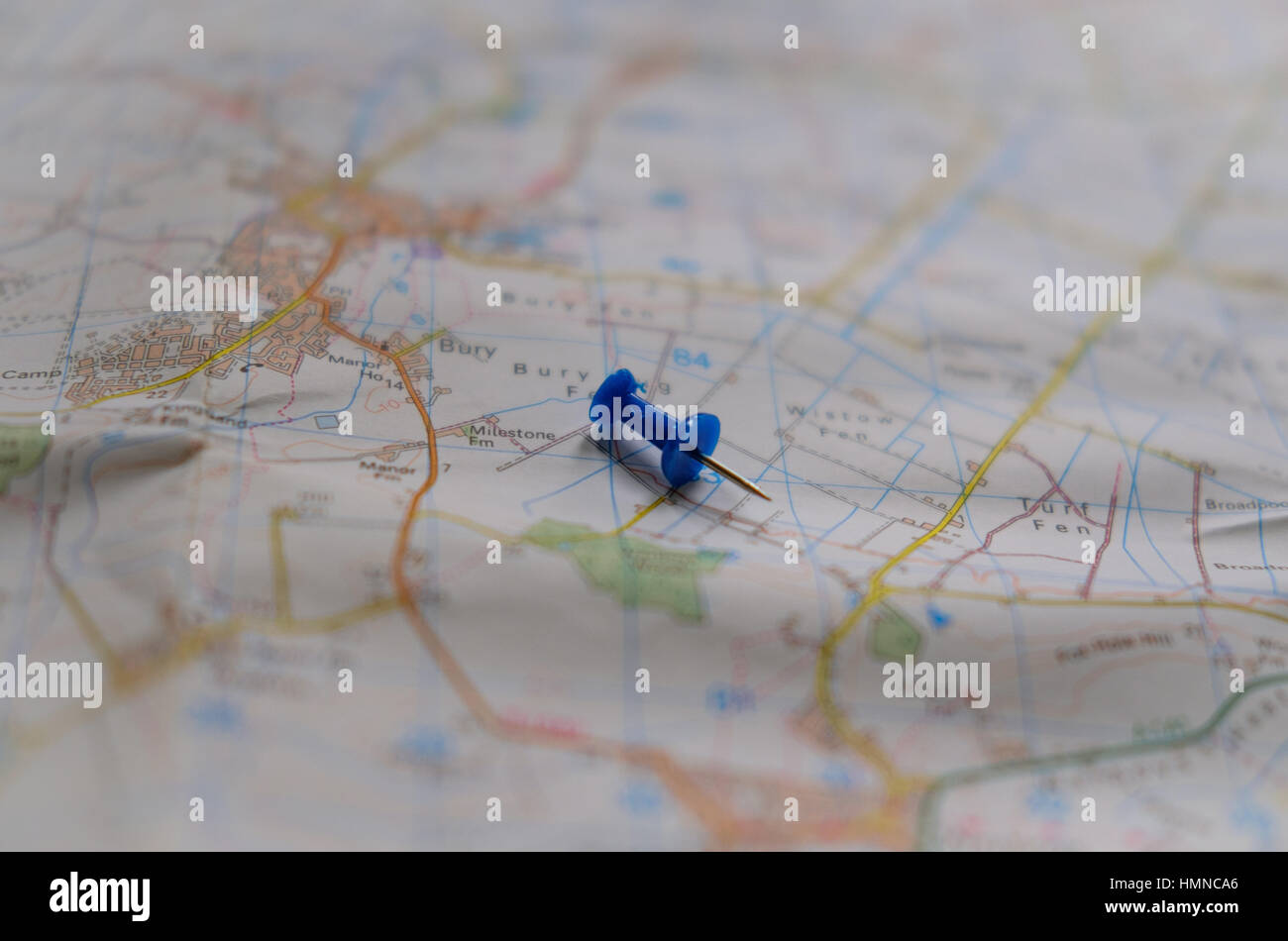 Close-up image of coloured pins seen on a hiking and trail paper map ...