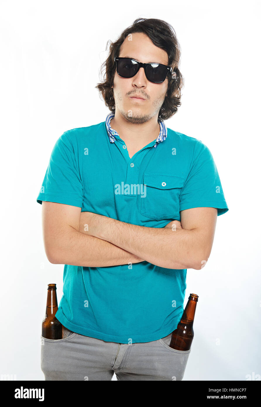 man with crossed arms and beer bottle in pocket isolated on white Stock ...
