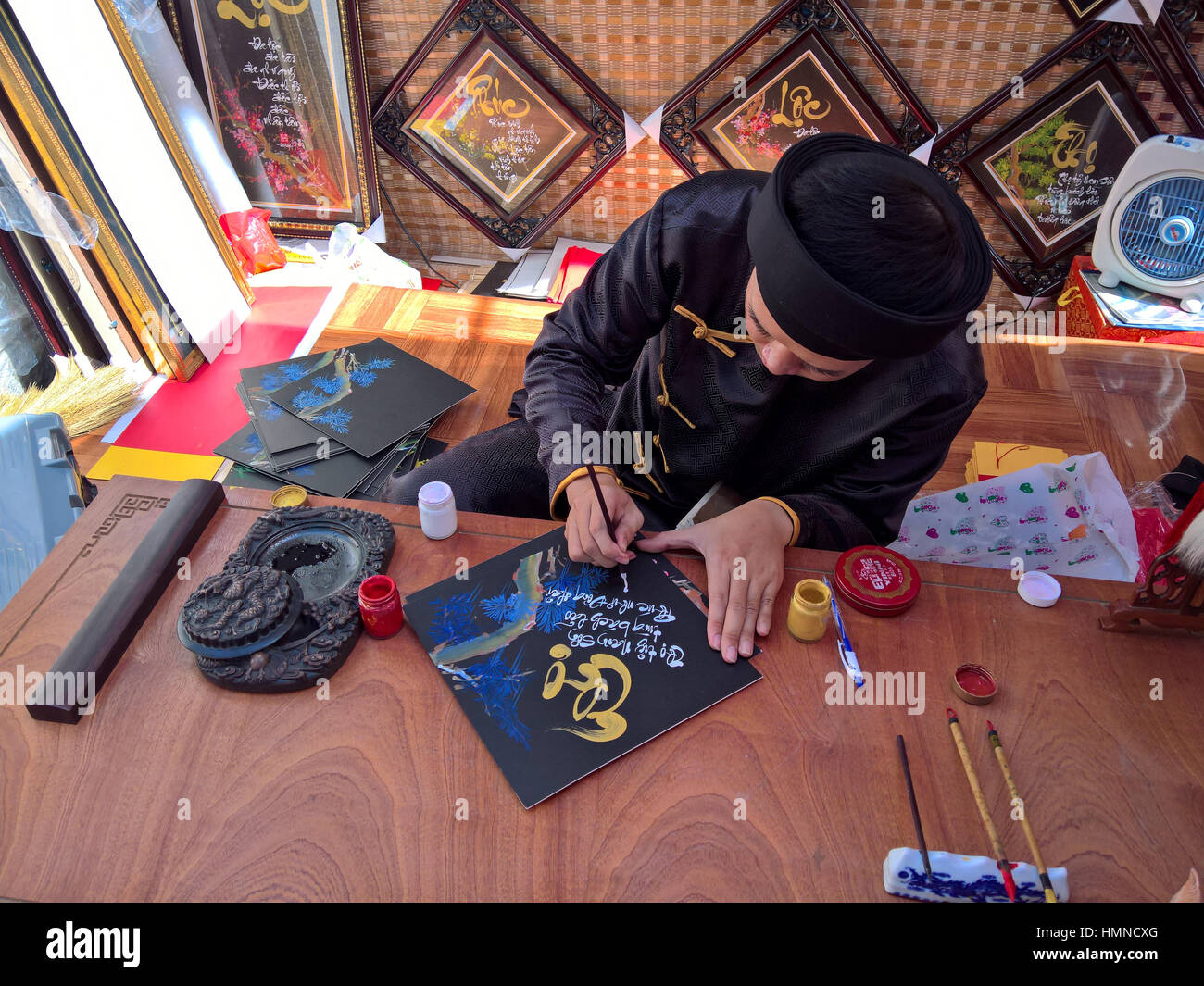 The scholar is writing the parallel sentences for Tet holiday Stock ...