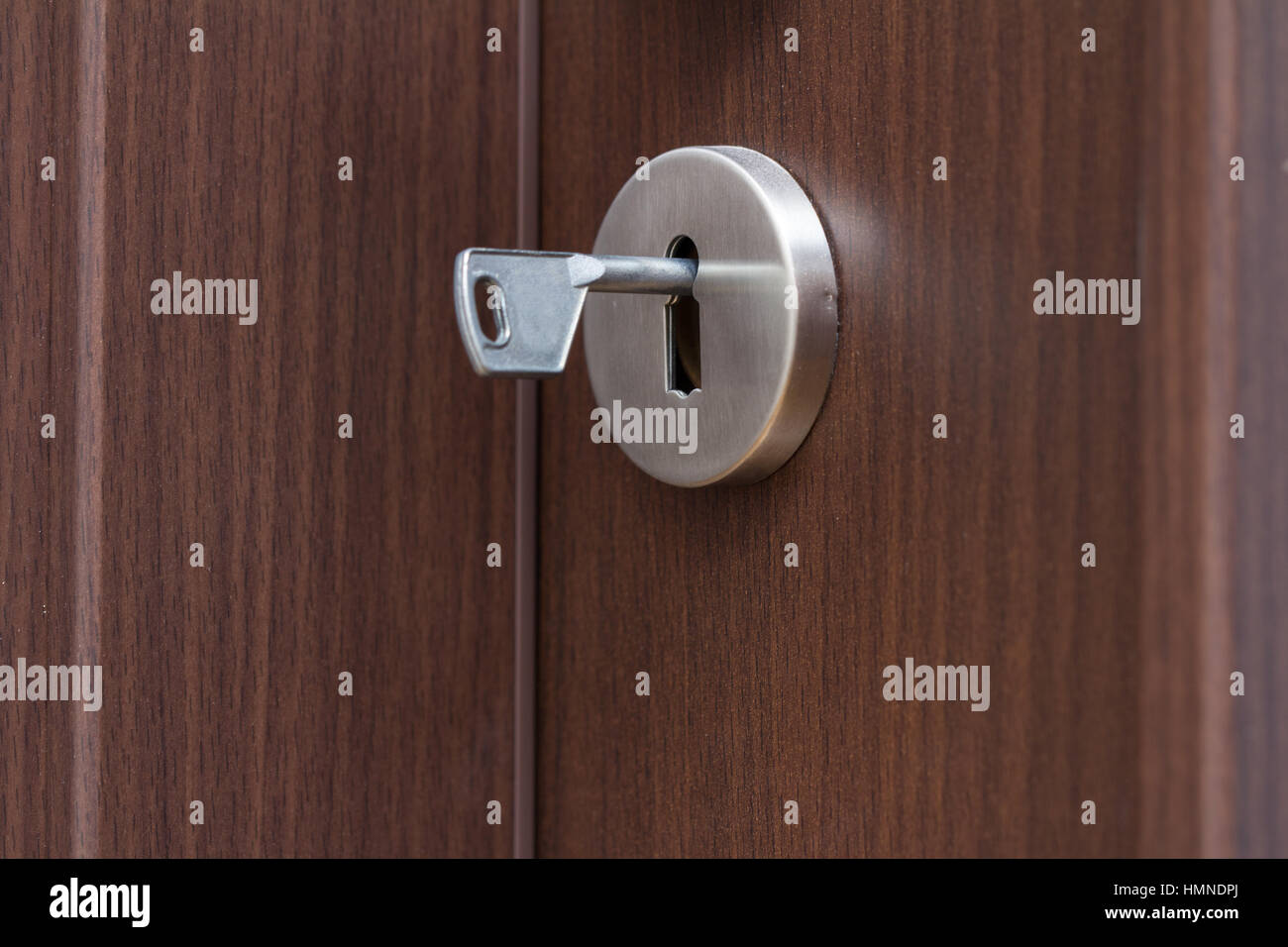 room key in keyhole Stock Photo - Alamy