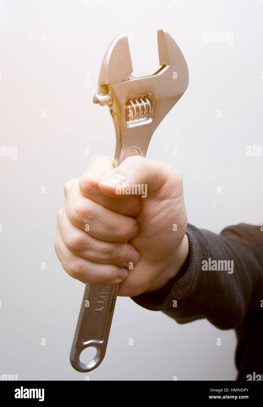 wrench in hand Stock Photo - Alamy