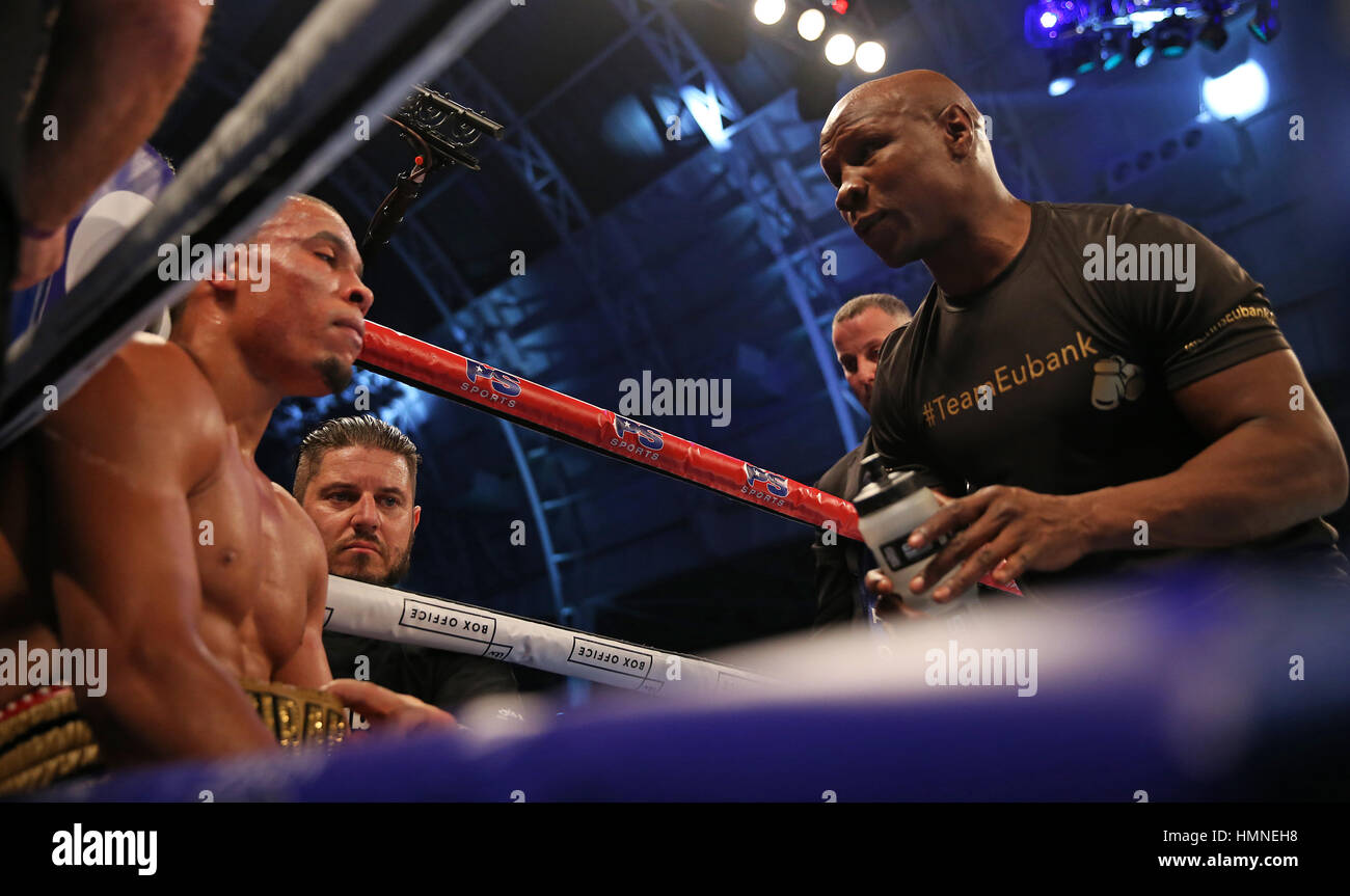 Chris Eubank Jr gets instructions from his father Chris Eubank Snr ...