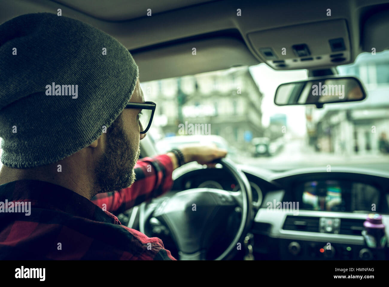 Handsome man driving luxury car wearing cap and sunglasses Stock Photo ...
