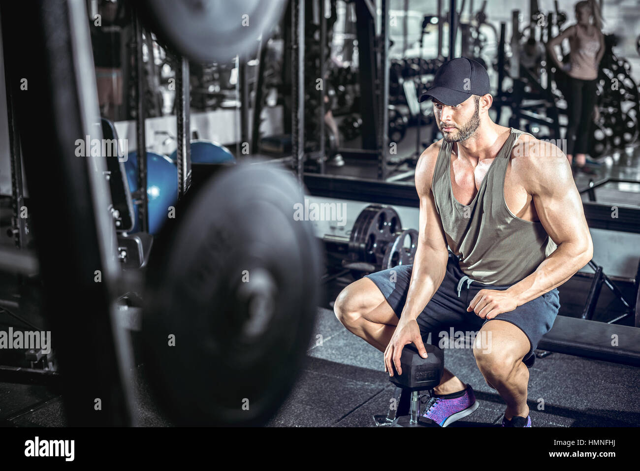 Attractive bodybuilder sitting on bench hi-res stock photography and ...