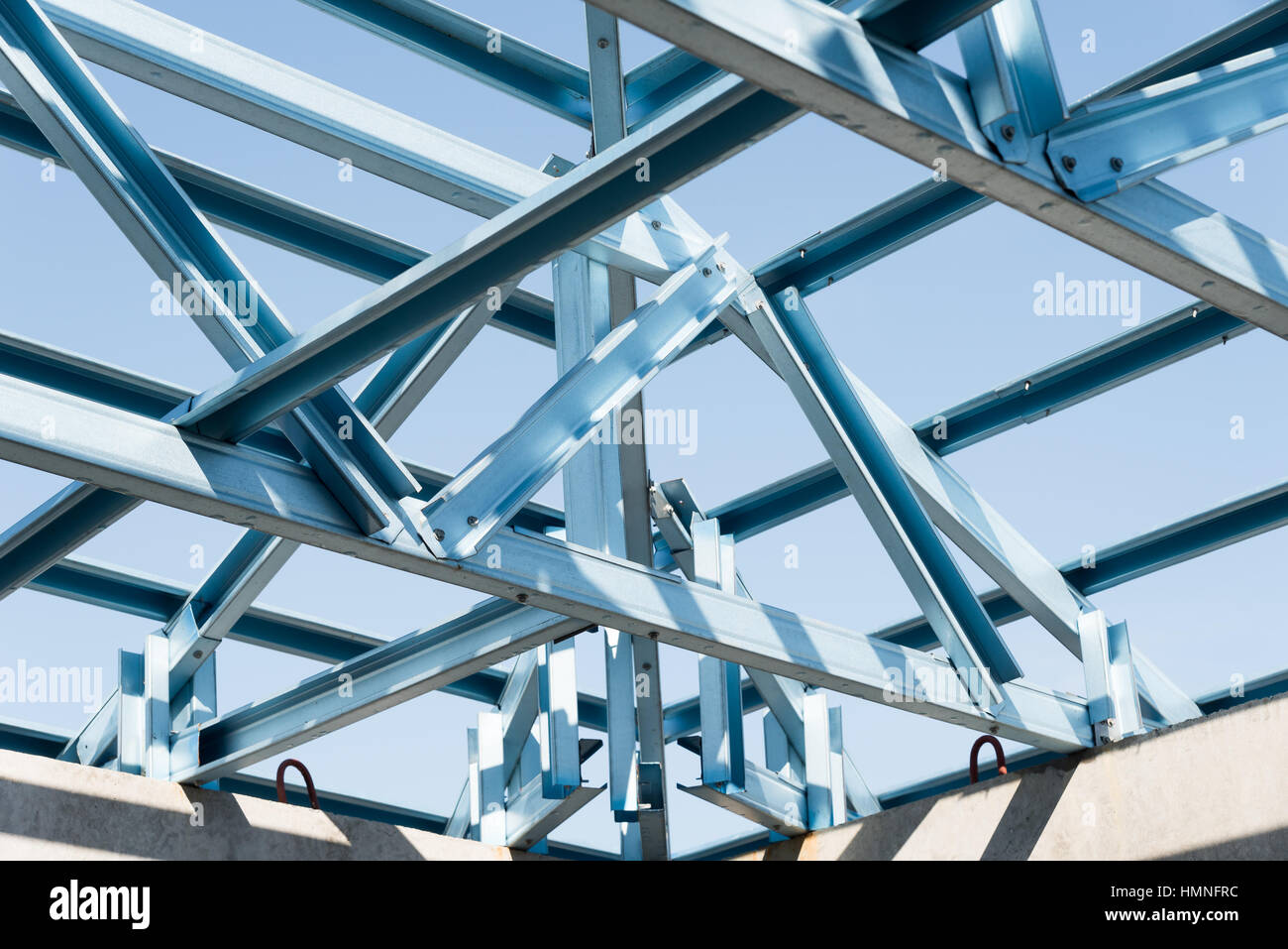 Structure of steel roof frame for building construction on sky ...