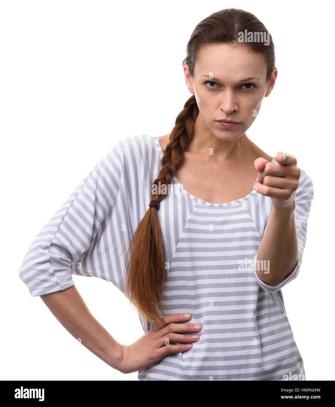 serious girl with braid pointing at you. Isolated on white background ...