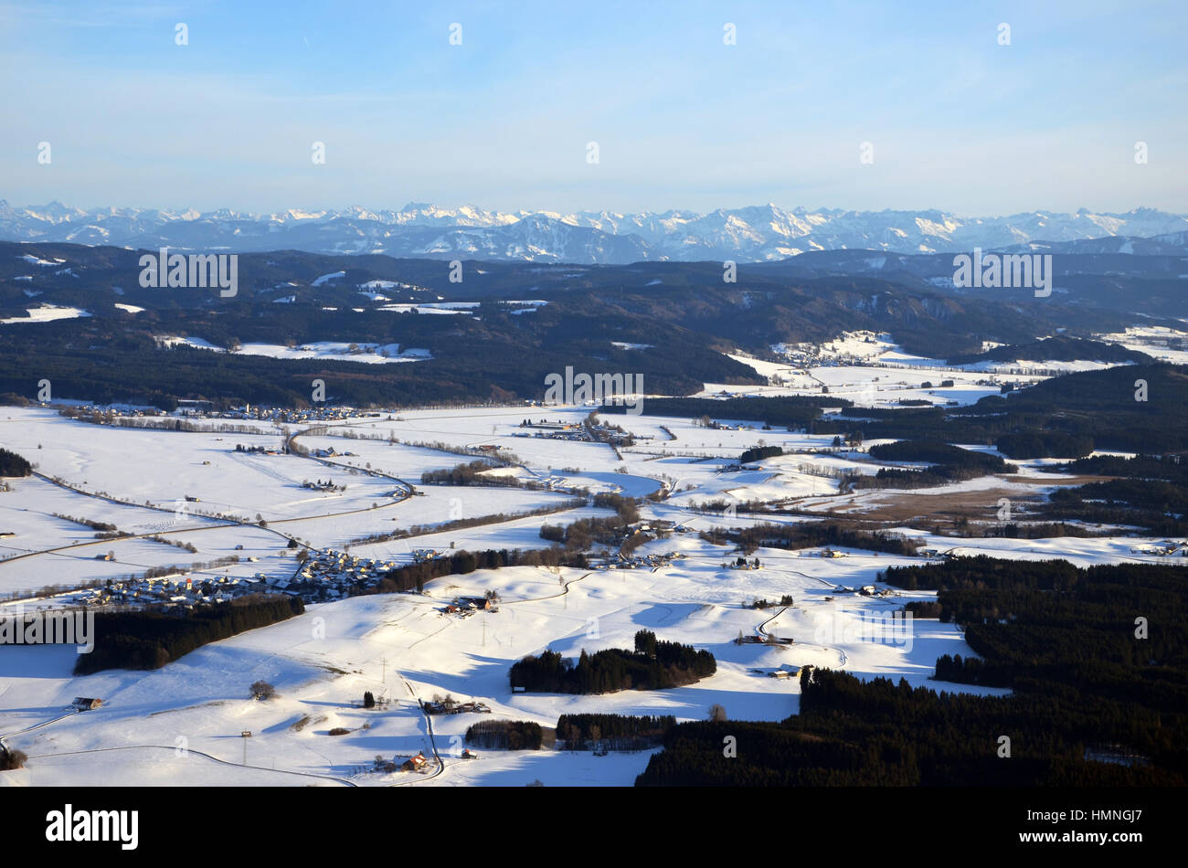 Aerial view of the Alps covered in snow, seen from southern germany in ...