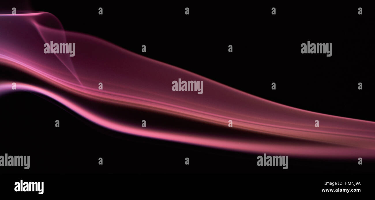 Red smooth line of smoke isolated on black Stock Photo - Alamy