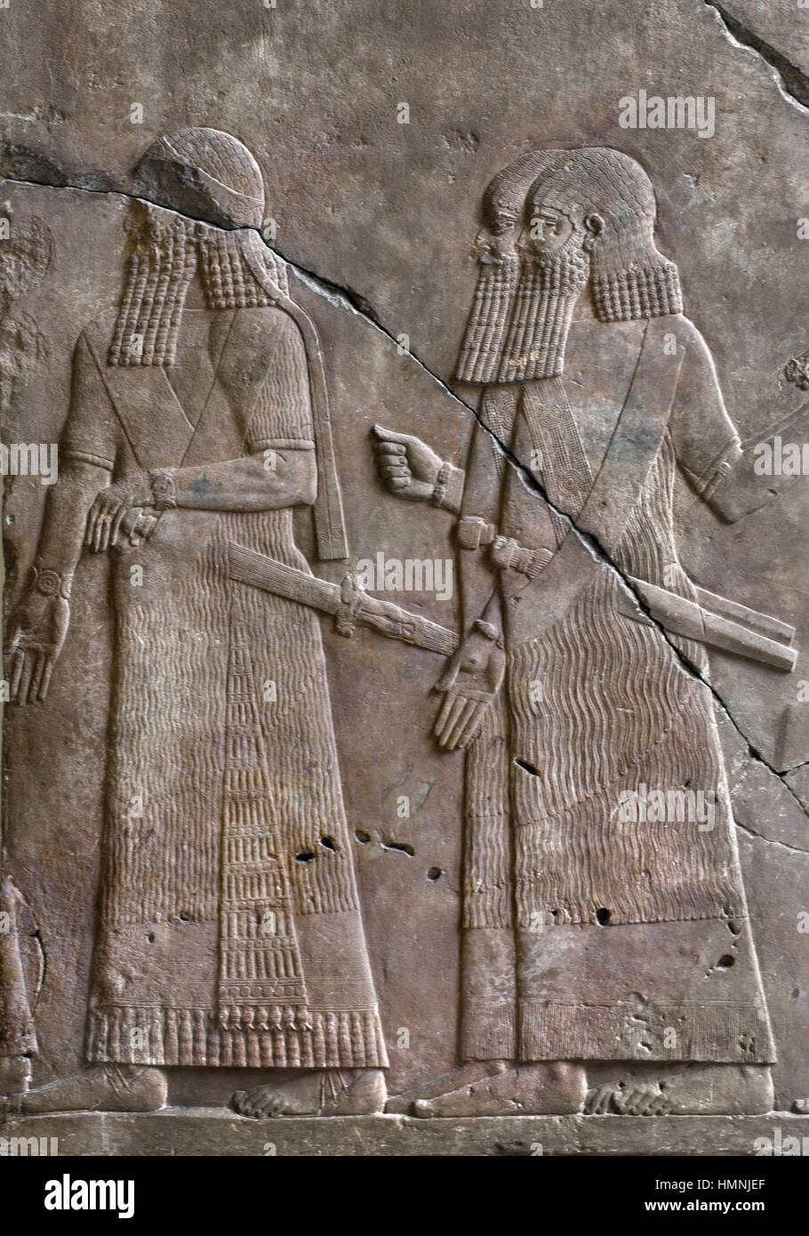 Assyrian officers and courtiers carrying a throne. Palace Relief from ...