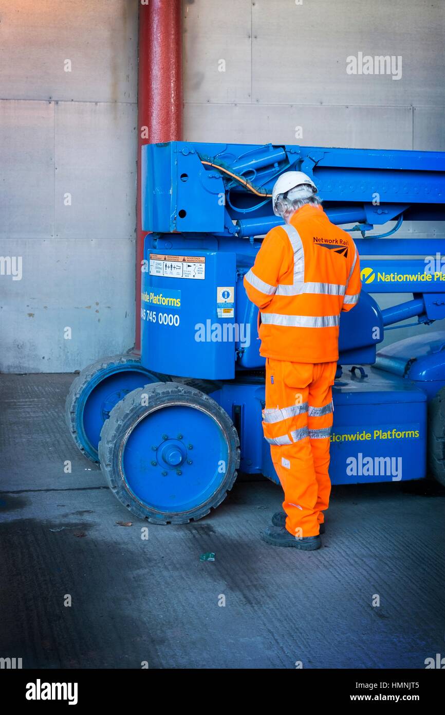 A Network rail engineer checking a platform access machine Stock Photo ...