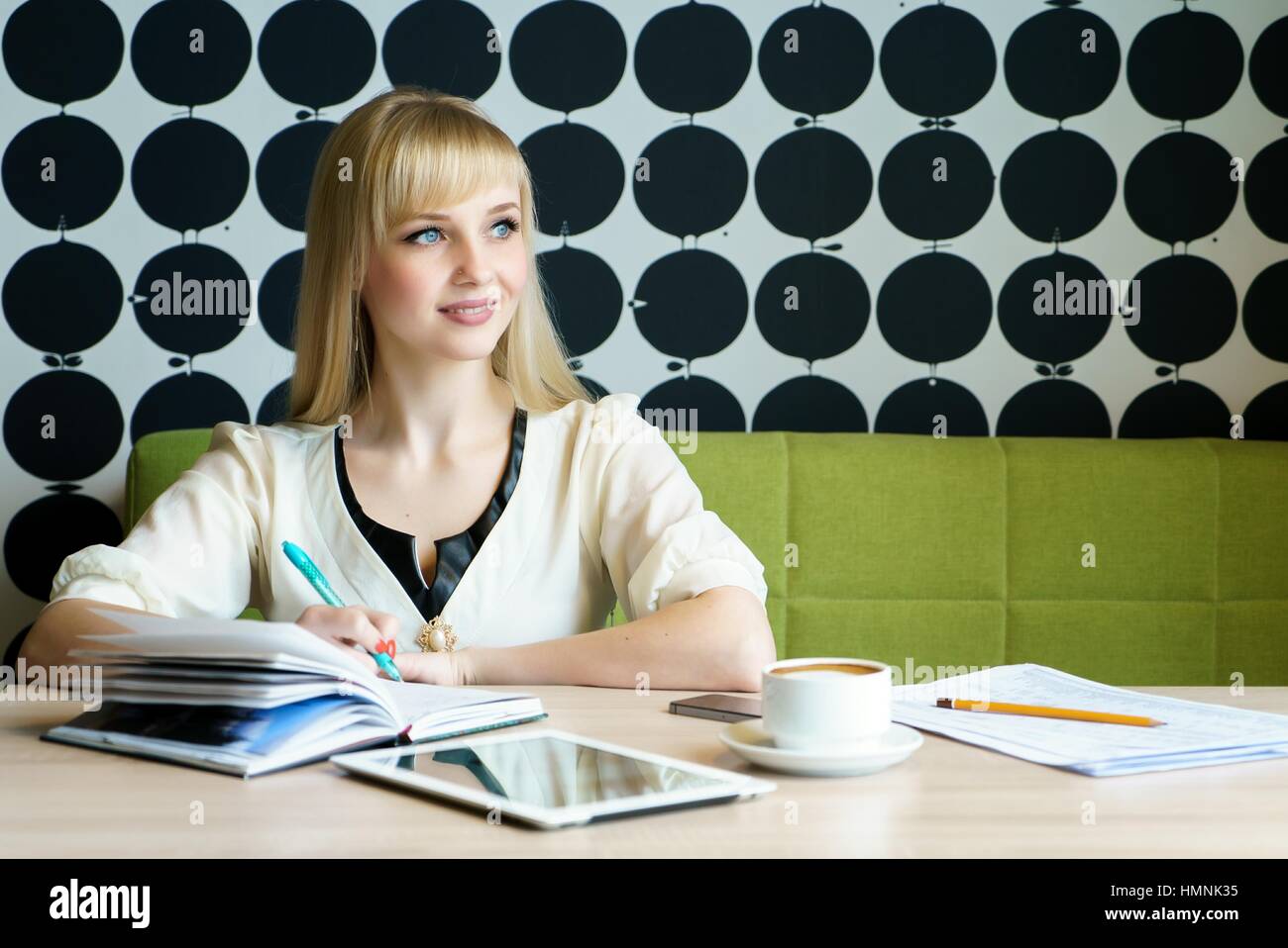 Girl writes text on paper sheets Stock Photo - Alamy