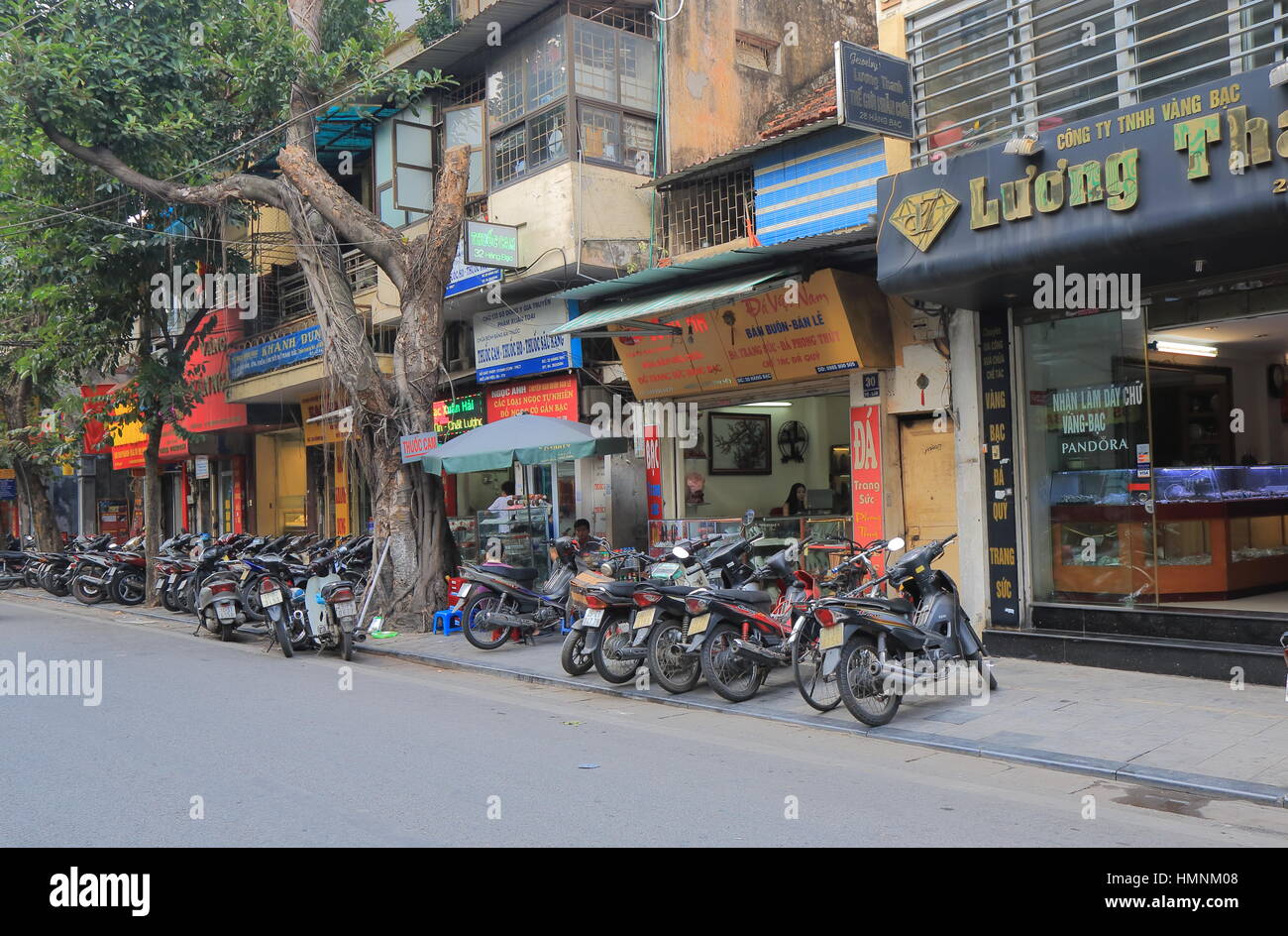 People visit Hang Bac shopping street in Hanoi Vietnam. Hang Bac street ...