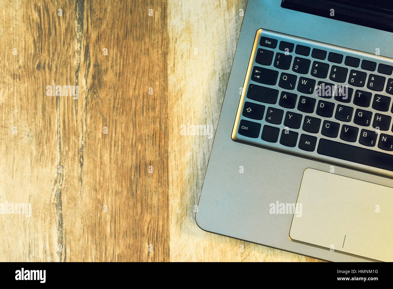 Laptop computer on rustic oak wood table, top view of modern technology ...