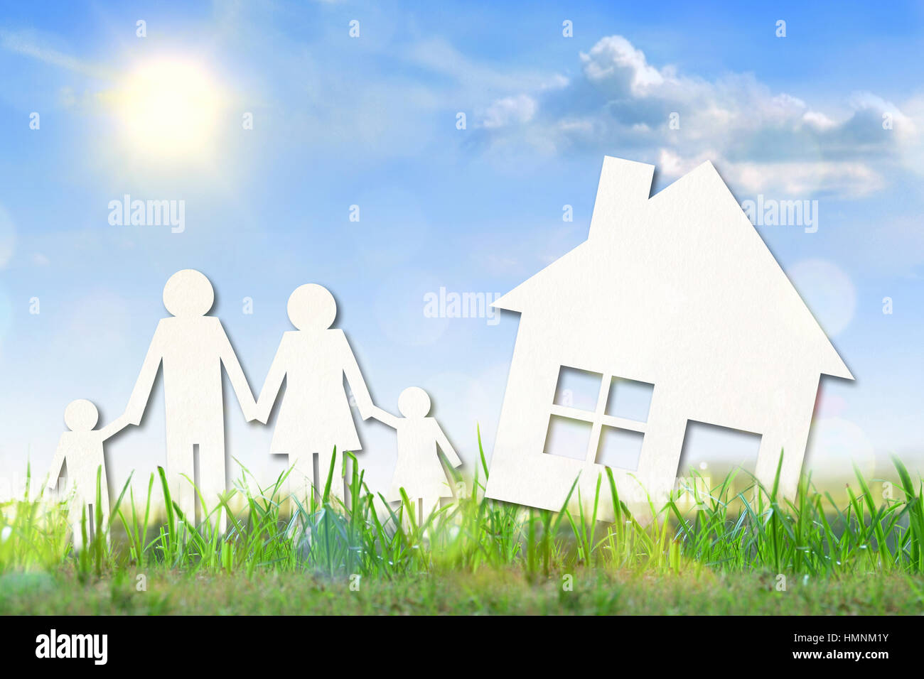Home and family concept with paper house on field background with grass ...
