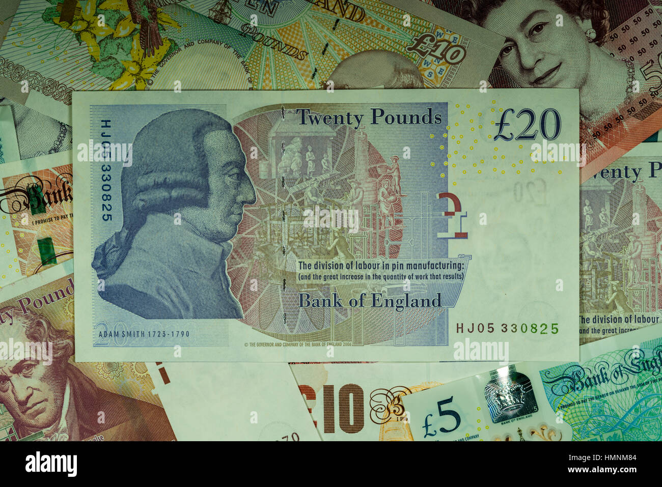 Twenty (20) pound UK banknote on a background of sterling banknotes ...
