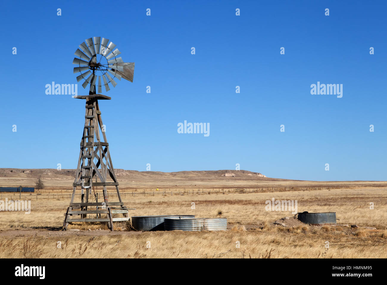 An agriculture farming windmill on the eastern plains of Colorado with ...