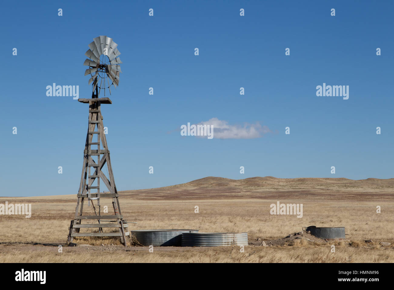 An agriculture farming windmill on the eastern plains of Colorado with ...