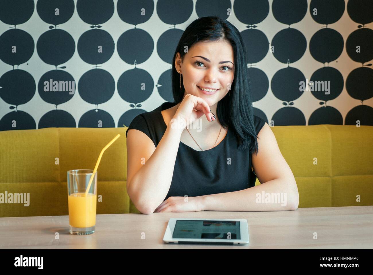 Positive girl smiling on camera Stock Photo - Alamy