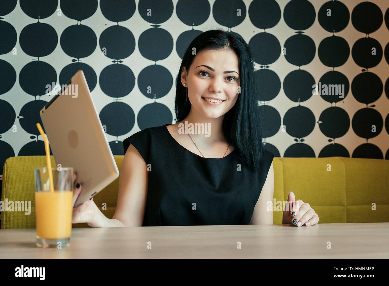 Brunette model aged 20s posing for camera indoors Stock Photo - Alamy