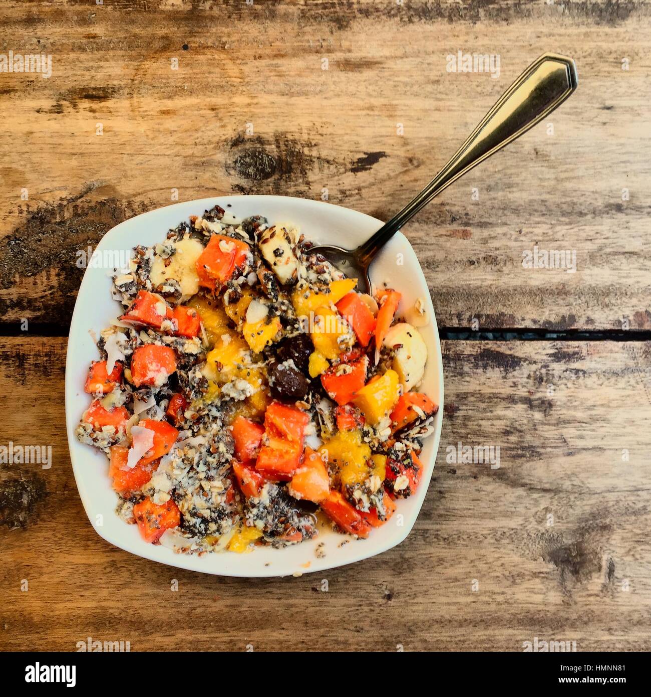 Healthy, organic breakfast bowl full of fruits, granola and chia seeds ...