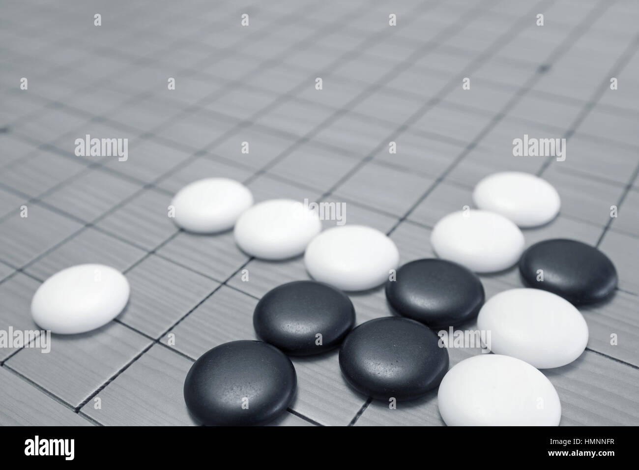 Go game or Weiqi (Chinese board game) background Stock Photo - Alamy