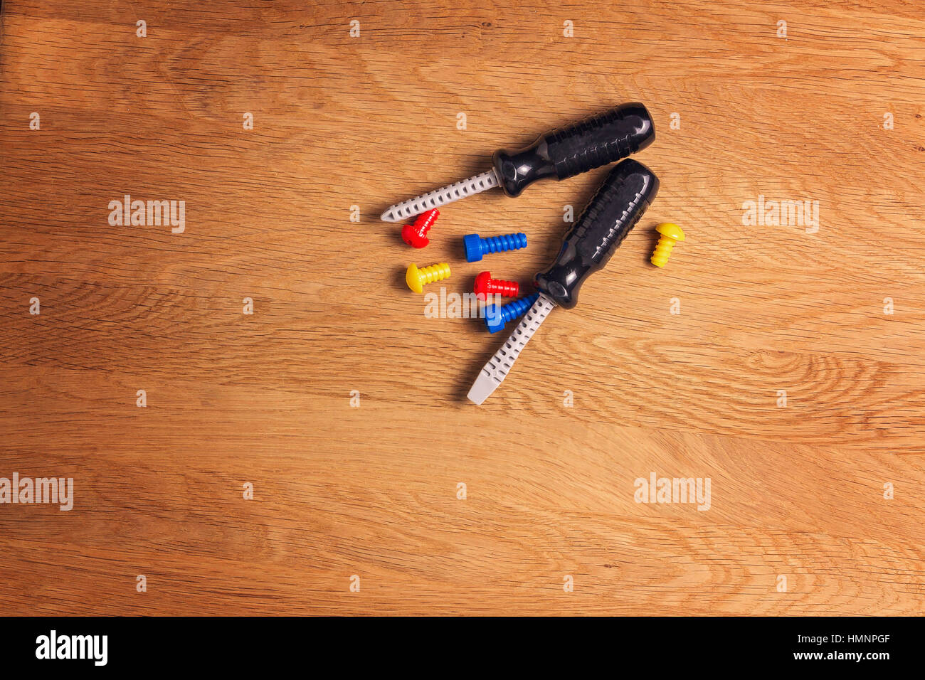 Kids toys tools: colorful plastic screwdrivers, screws and nuts on ...