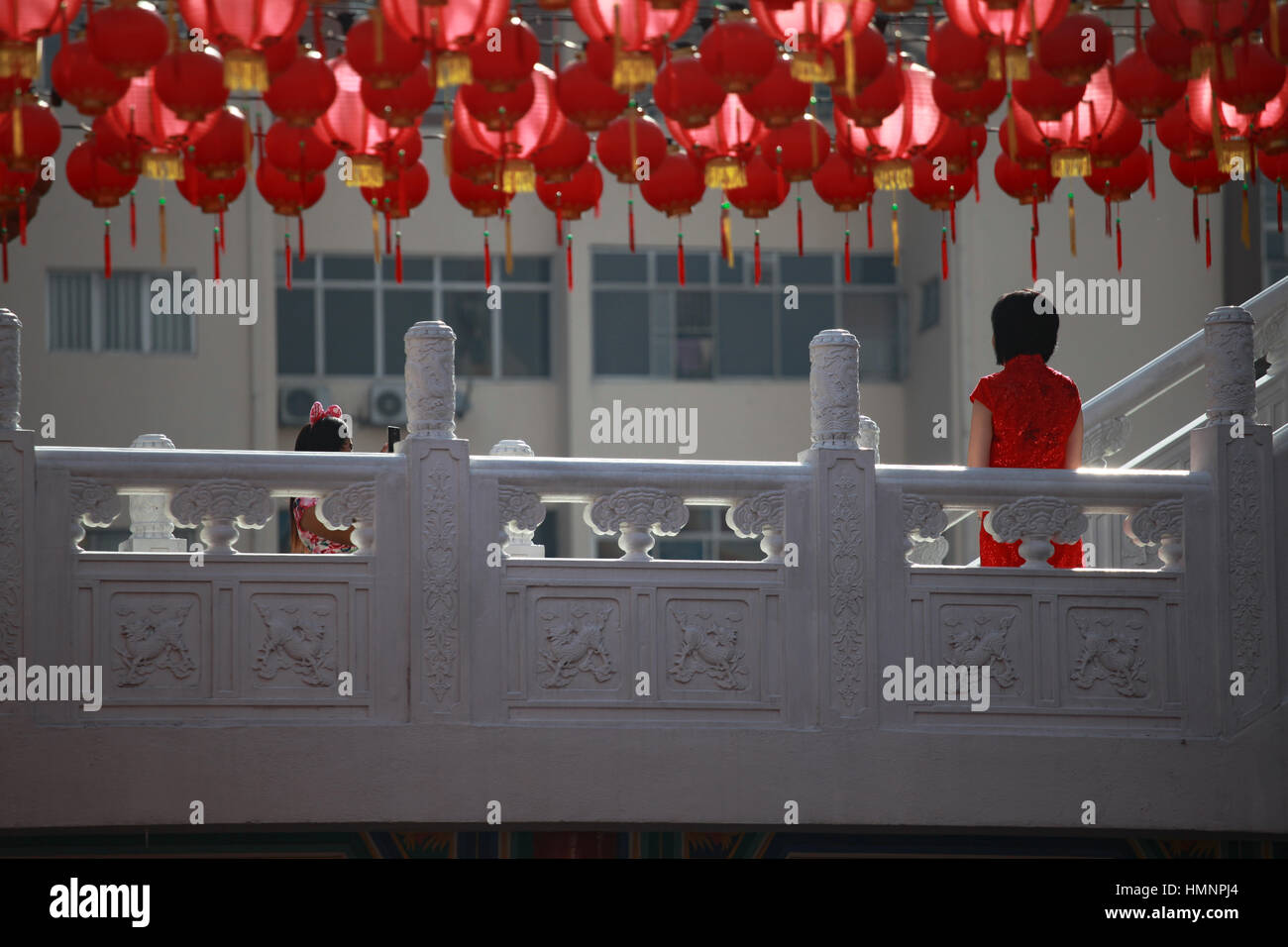 Kuala Lumpur, Malaysia - JANUARY 28, 2017. Backlight figure of woman ...