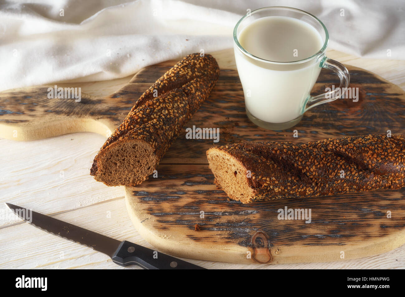breakfast: glass of milk and loaf Stock Photo - Alamy