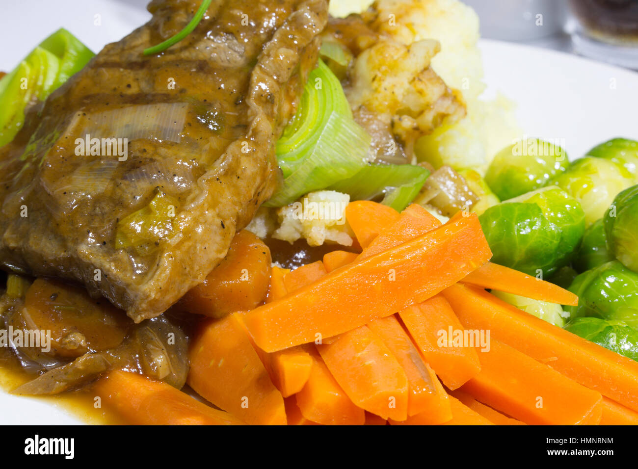 A pub/restaurant dish of Braised Beef Steak served with creamed potato ...
