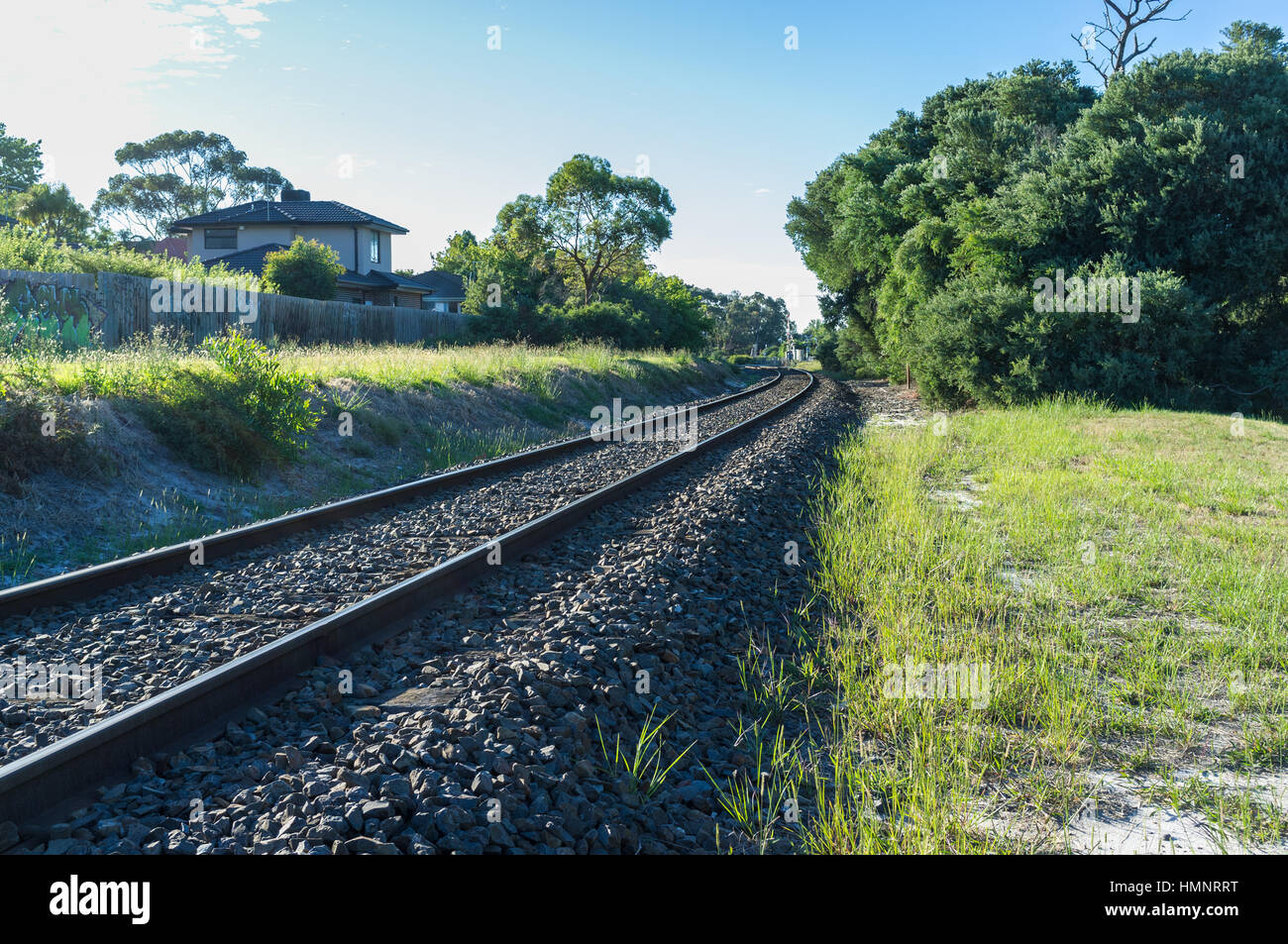 Rail tracks winding into the distance in rural area Stock Photo - Alamy