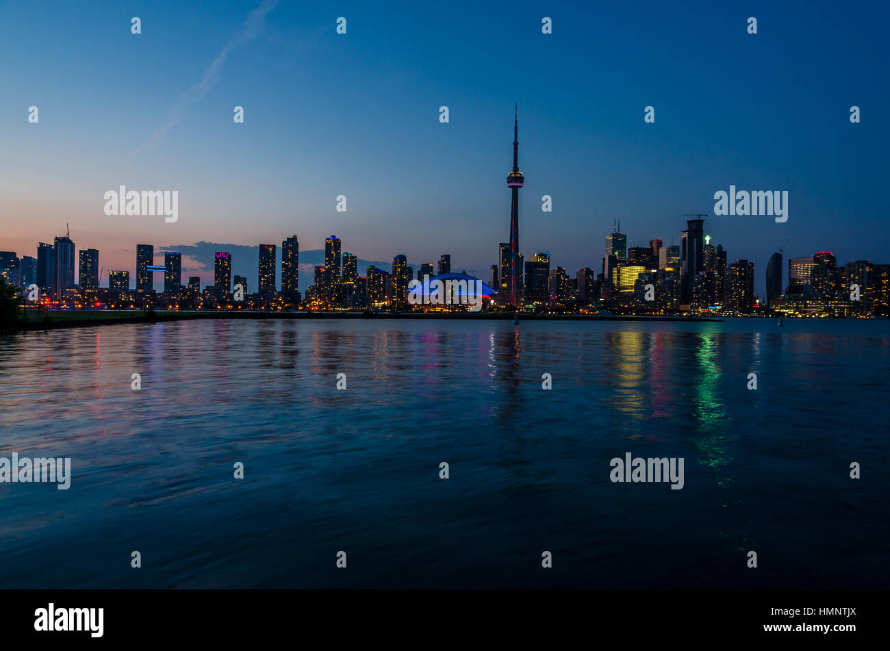 Skyline of Toronto over Ontario Lake after sunset Stock Photo - Alamy