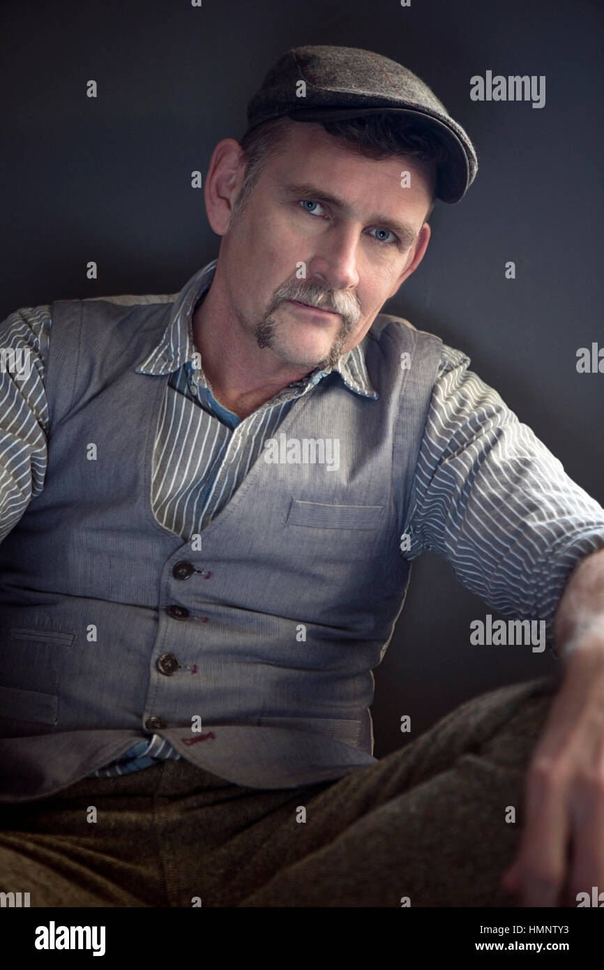 portrait of handsome stylish man in his 50s Stock Photo - Alamy