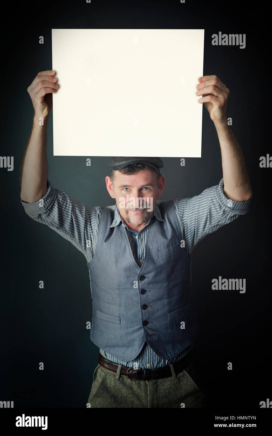 handsome stylish man holding a white sign Stock Photo - Alamy
