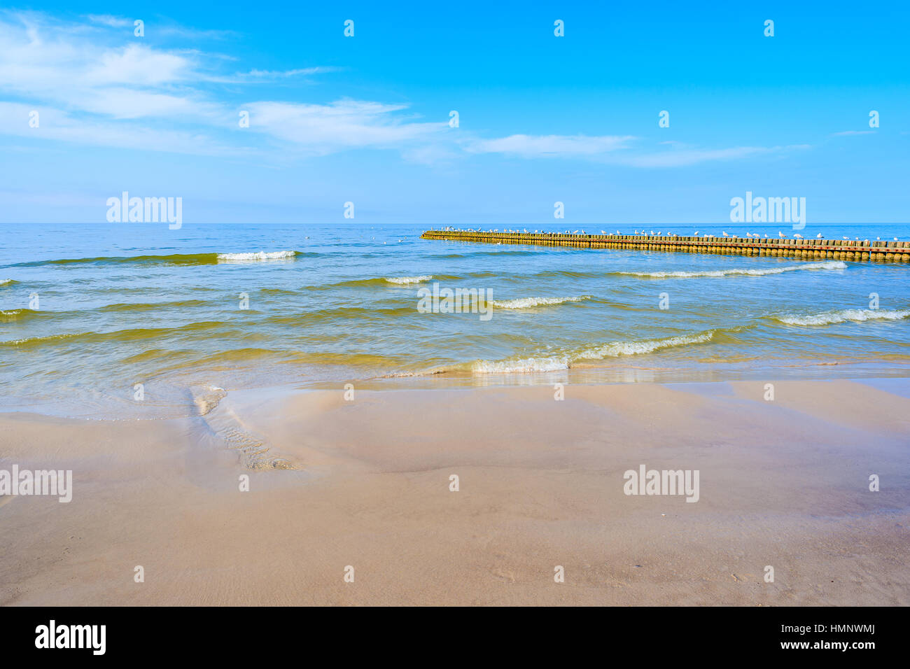Sea waves on Leba beach with breakwaters in background, Baltic Sea ...