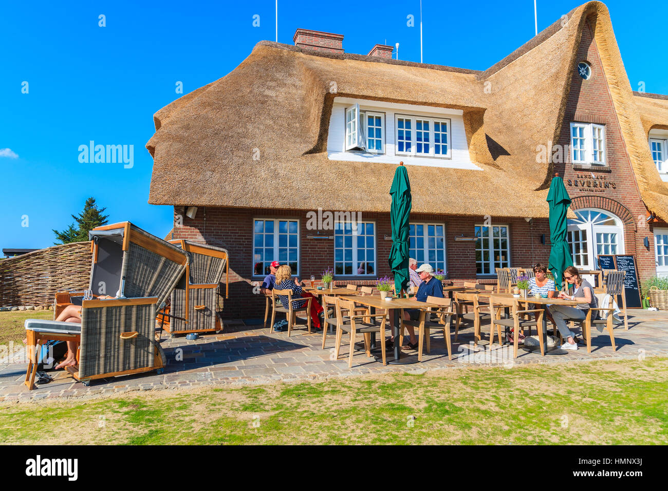 SYLT ISLAND, GERMANY - SEP 9, 2016: people dining in restaurant near ...
