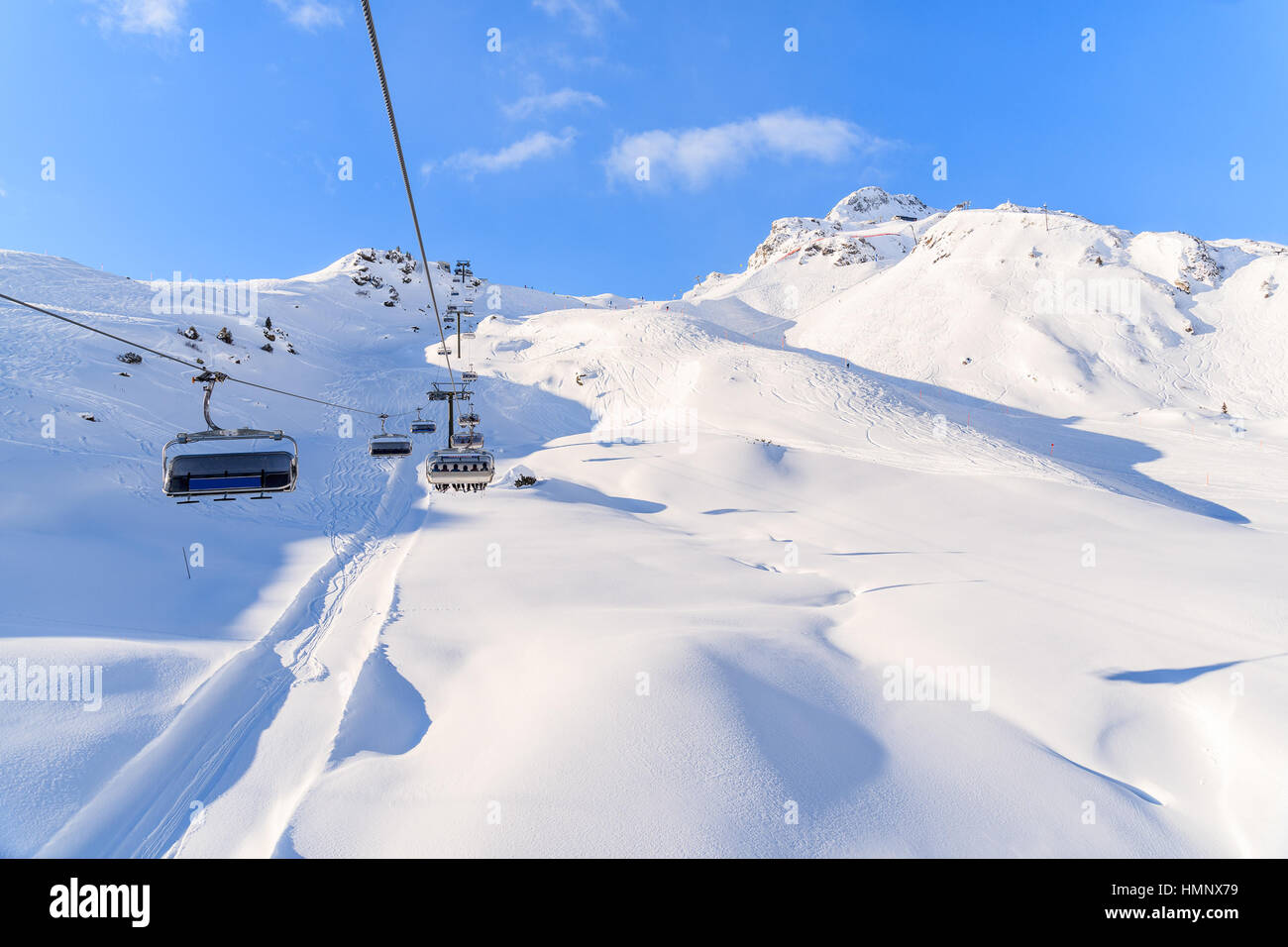View of chairlifts and beautiful winter scenery in Obertauern ski ...