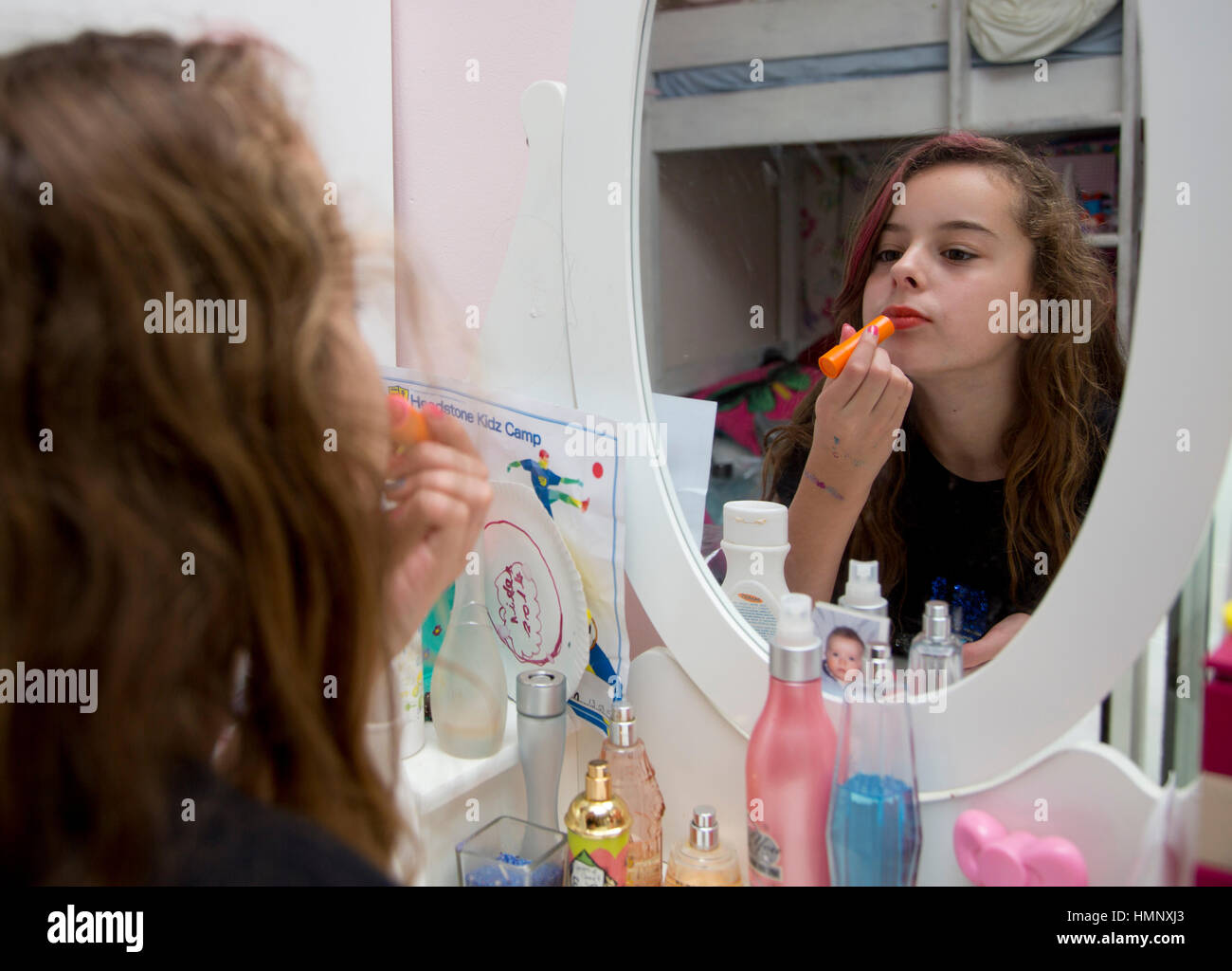 10 year old girl putting on makeup Stock Photo - Alamy