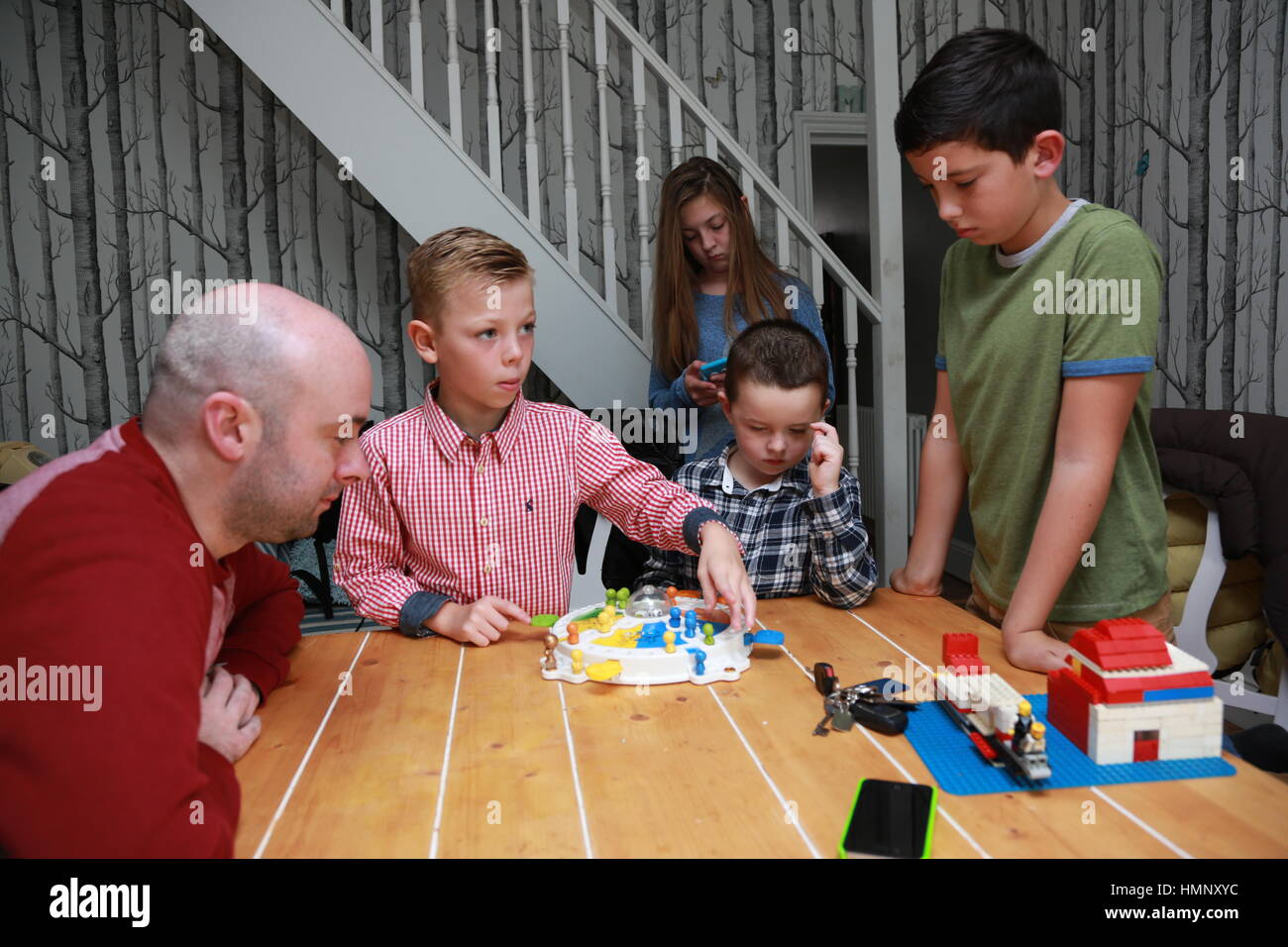 Family playing board games Stock Photo - Alamy