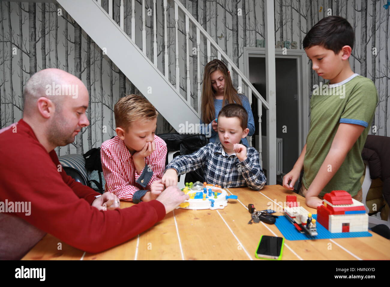 Family playing board games Stock Photo - Alamy