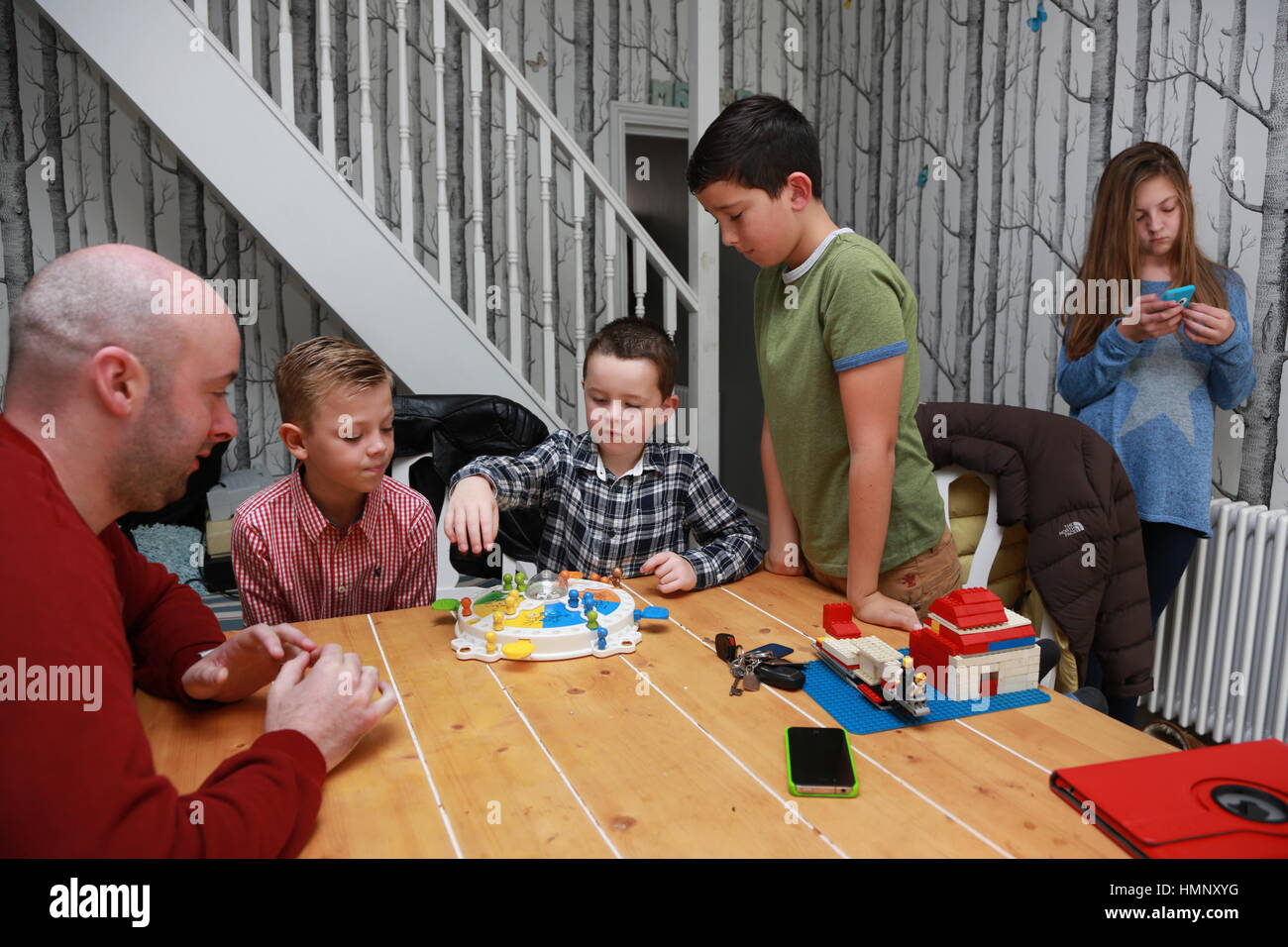 Family playing board games Stock Photo - Alamy