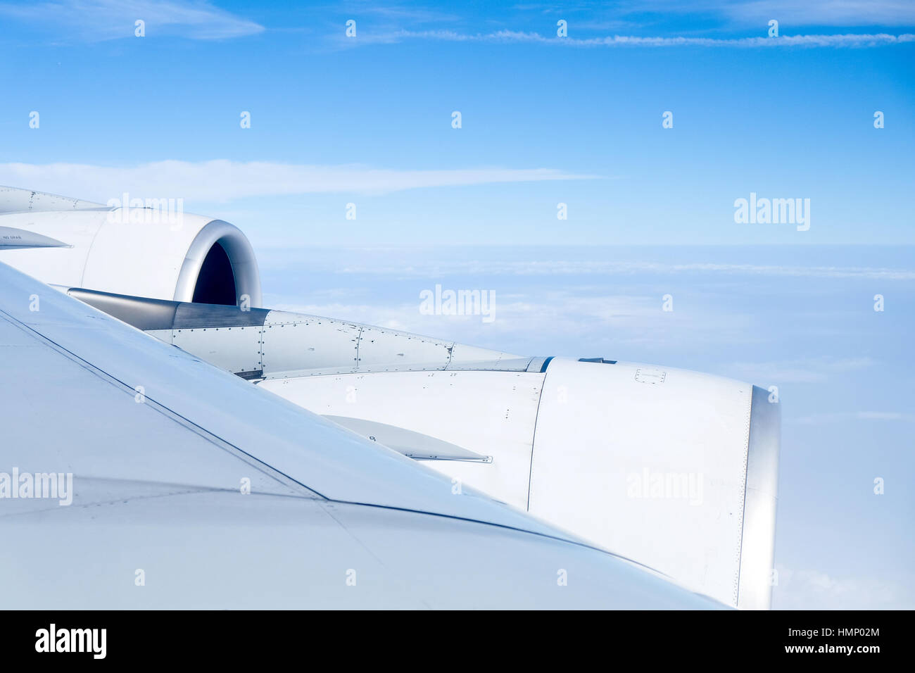 Looking through window aircraft during flight in wing with blue sky ...