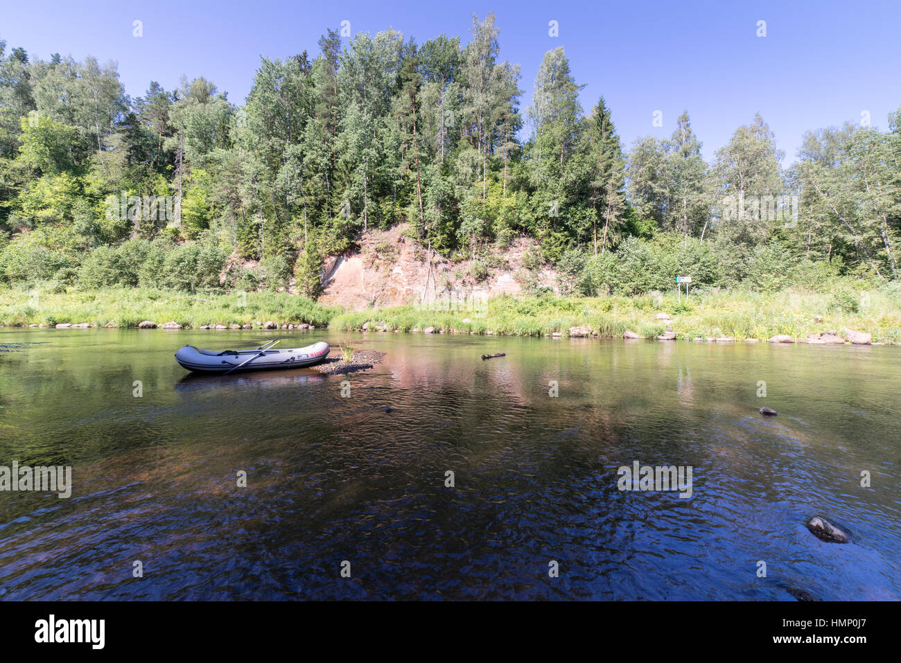 tourists enjoying water sports, kayaking in wild river - Sigulda ...