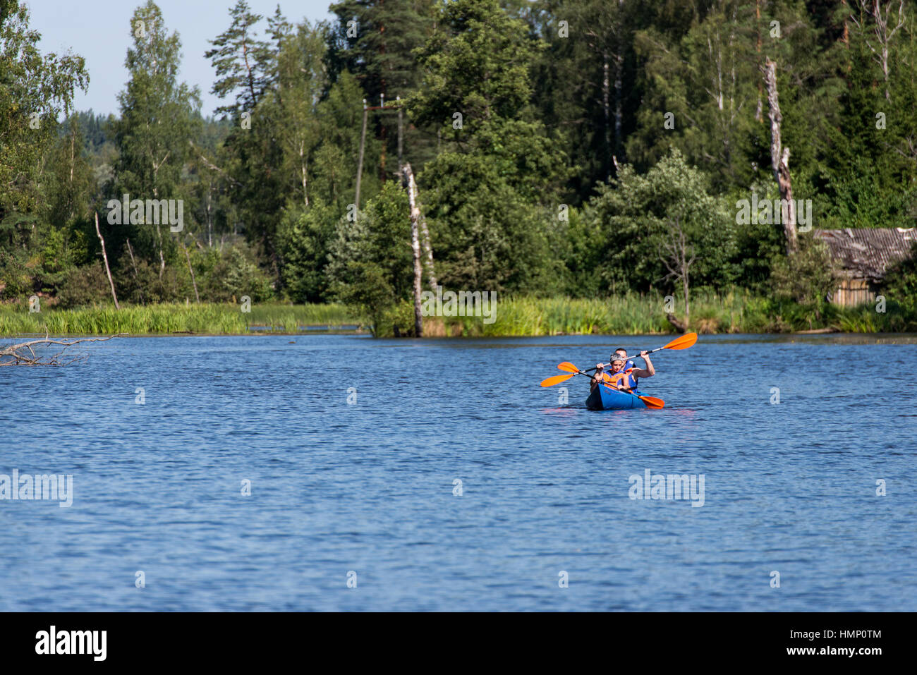 tourists enjoying water sports, kayaking in wild river - Sigulda ...